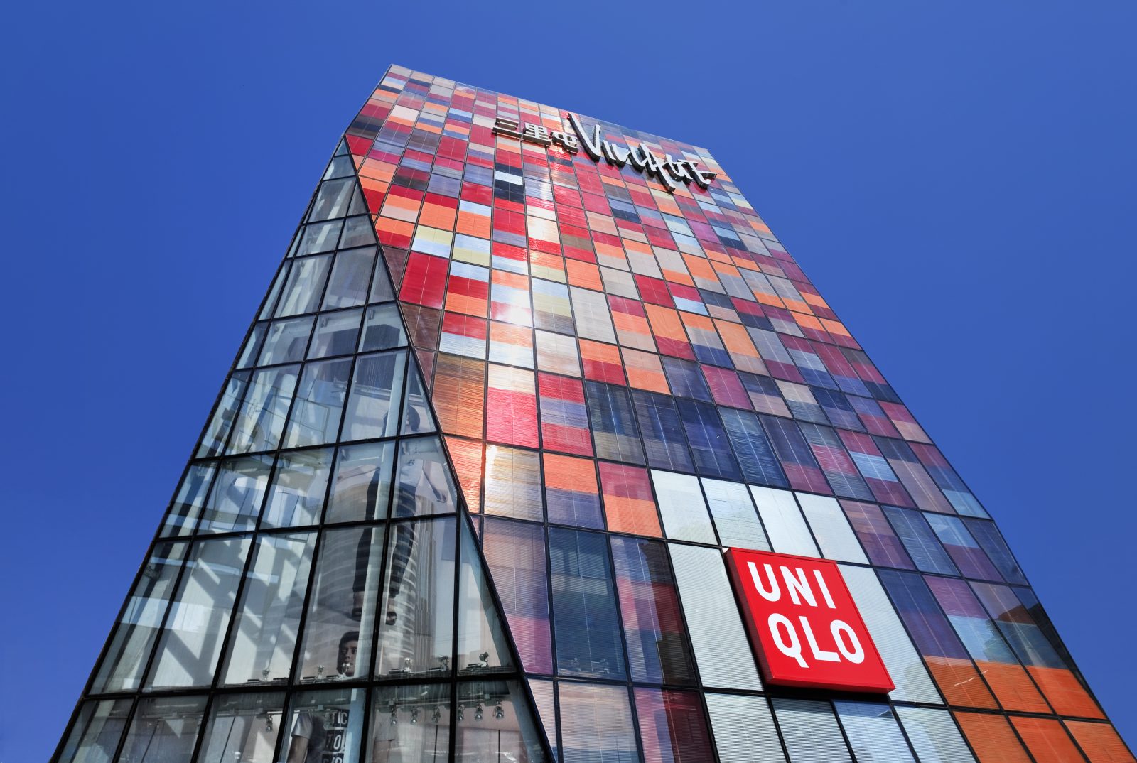 Uniqlo owner lowers revenue expectations