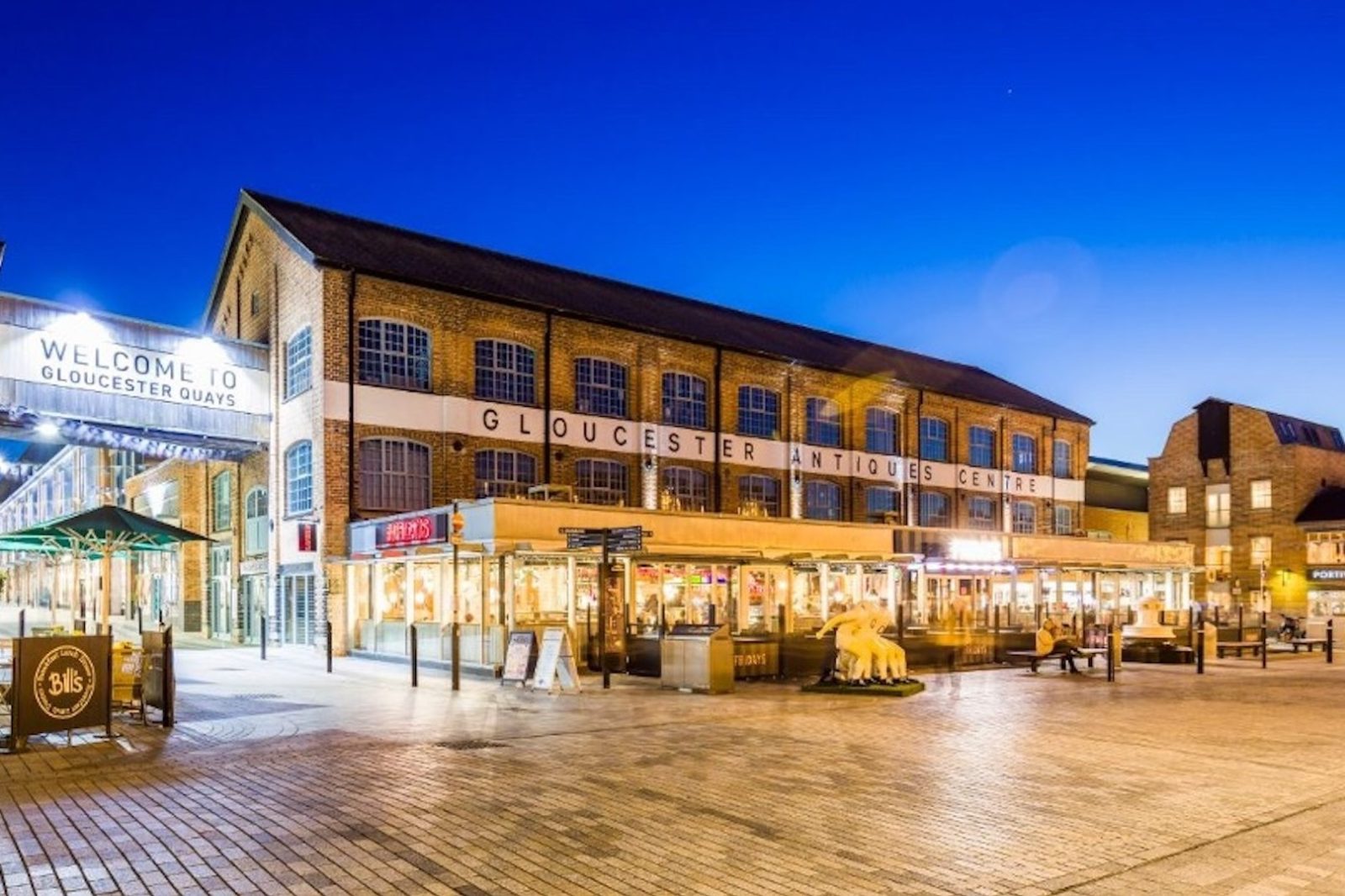 Next returns to Gloucester Quays