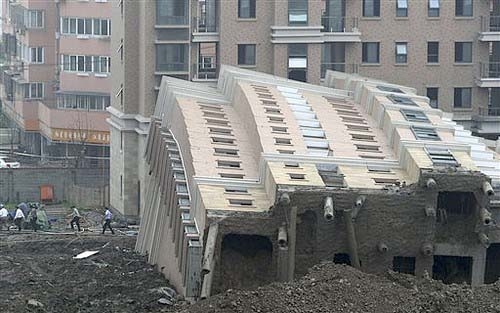 Incredible pictures of tower which toppled over - in one piece