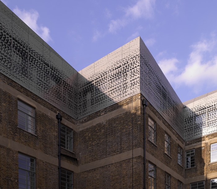 Rare Architecture transforms town hall with laser-cut aluminium skin