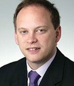 Shapps: Eco-towns funding halved