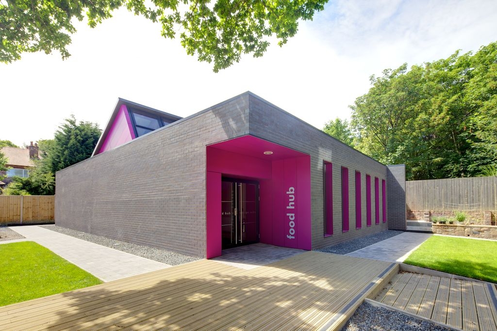 Studio Three shows off black brick and magenta food hub
