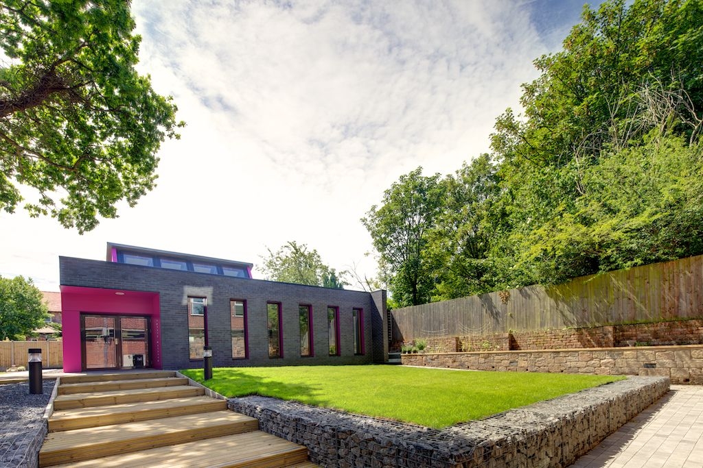 Studio Three shows off black brick and magenta food hub