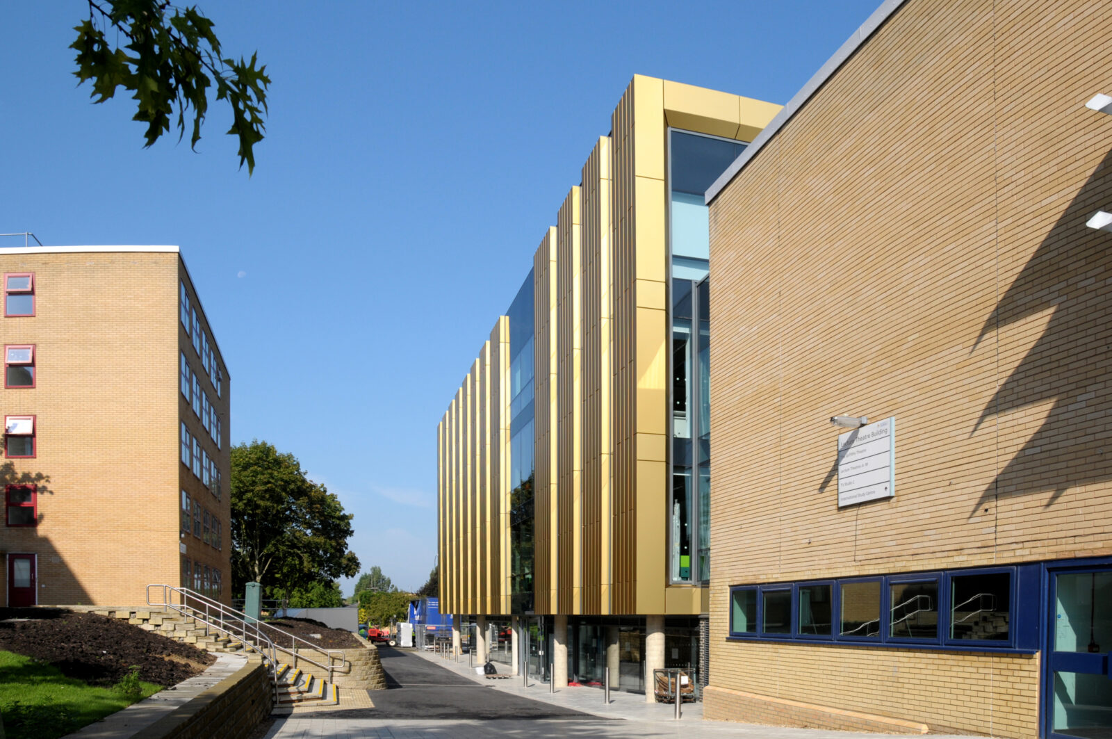 RMJM's 'gold and bronze' learning centre opens at Surrey University