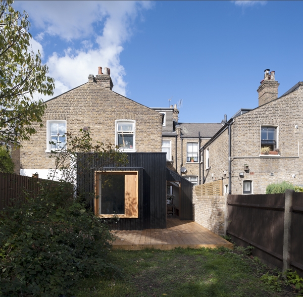 Oliver Bayliss unveils black timber extension