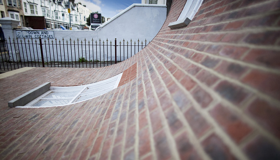 In pictures: Artist completes house with slipping facade