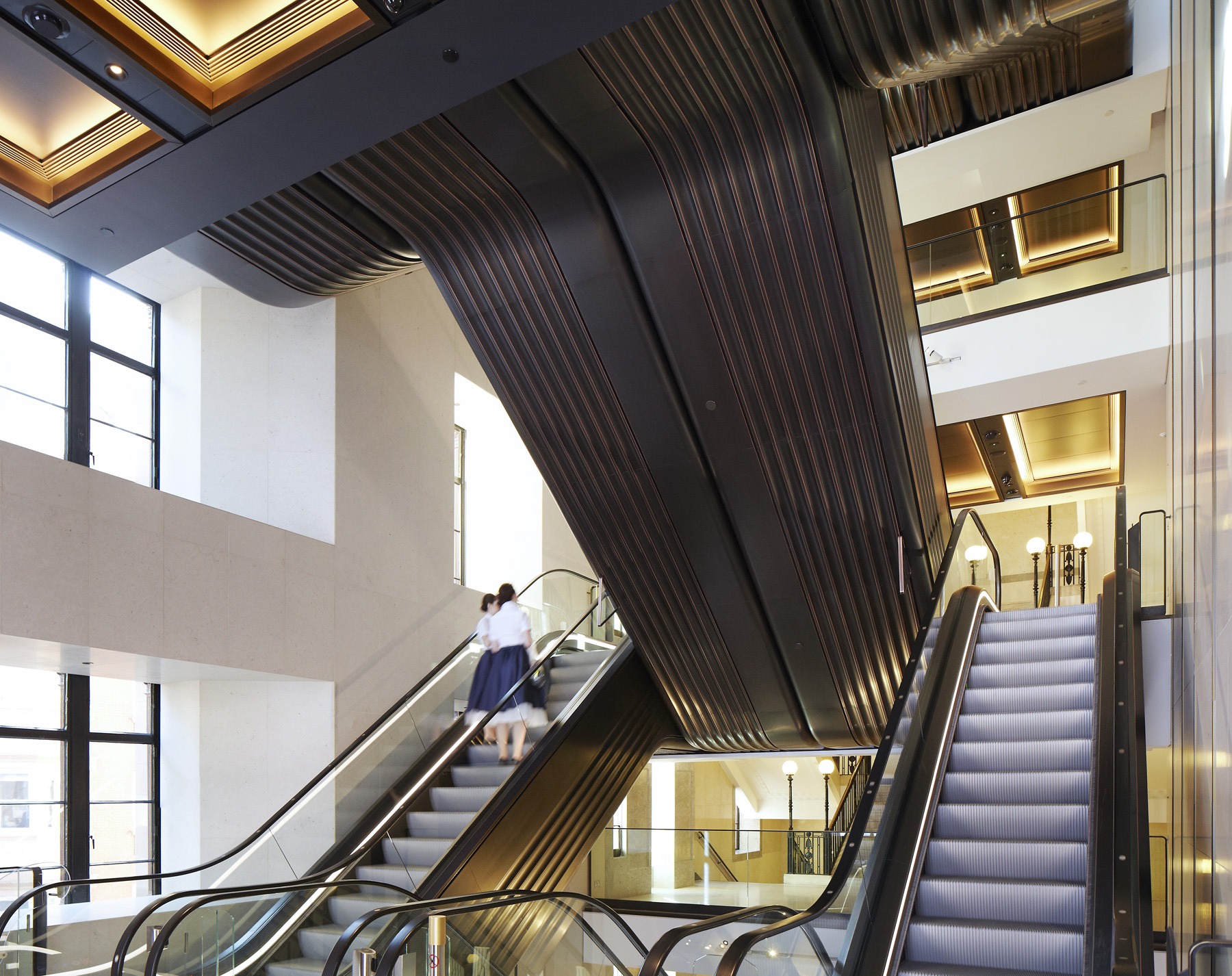 Make reveals bronze-clad Harrods escalators