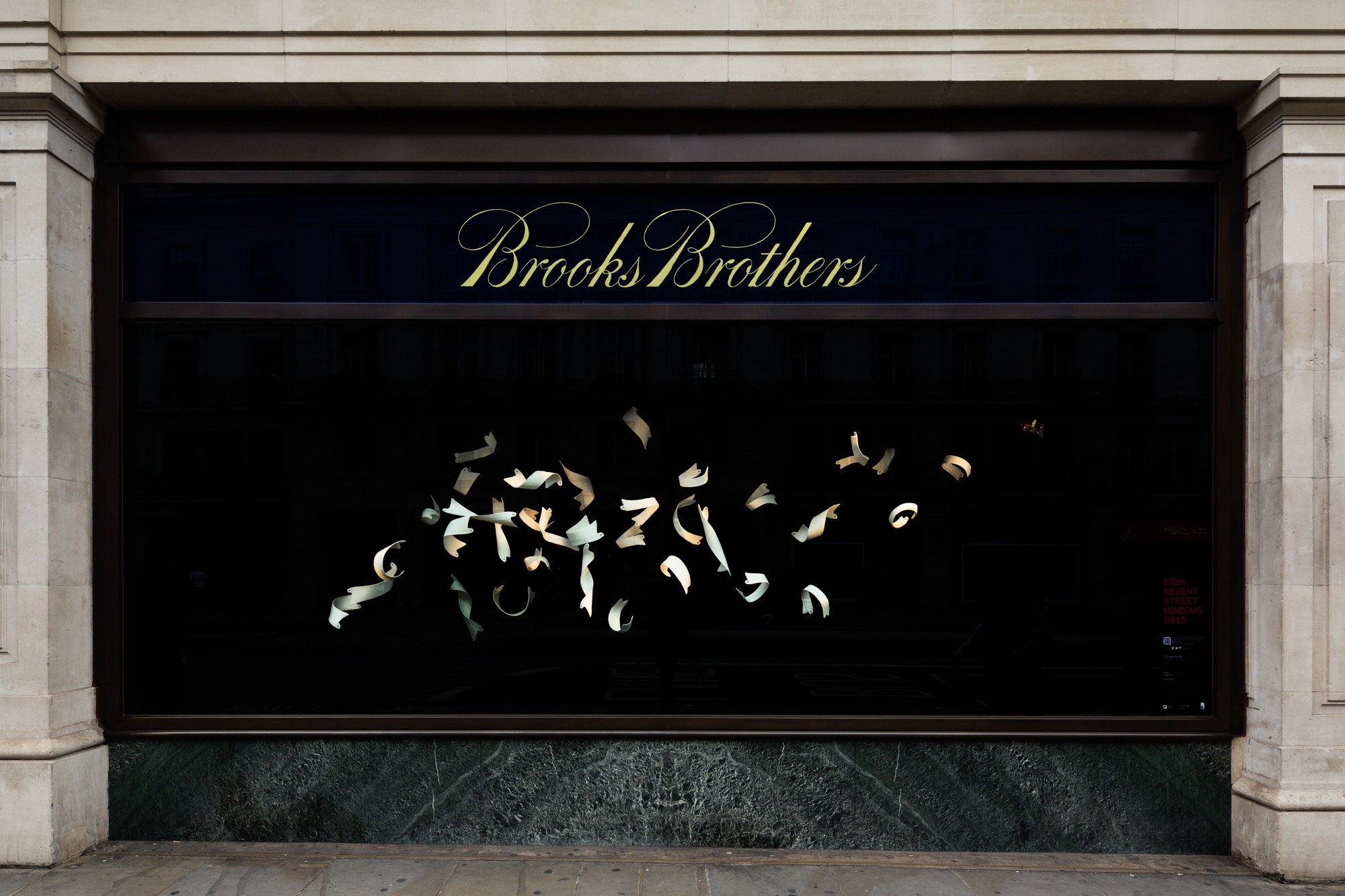 Wraps taken off architects' Regent Street shop window designs