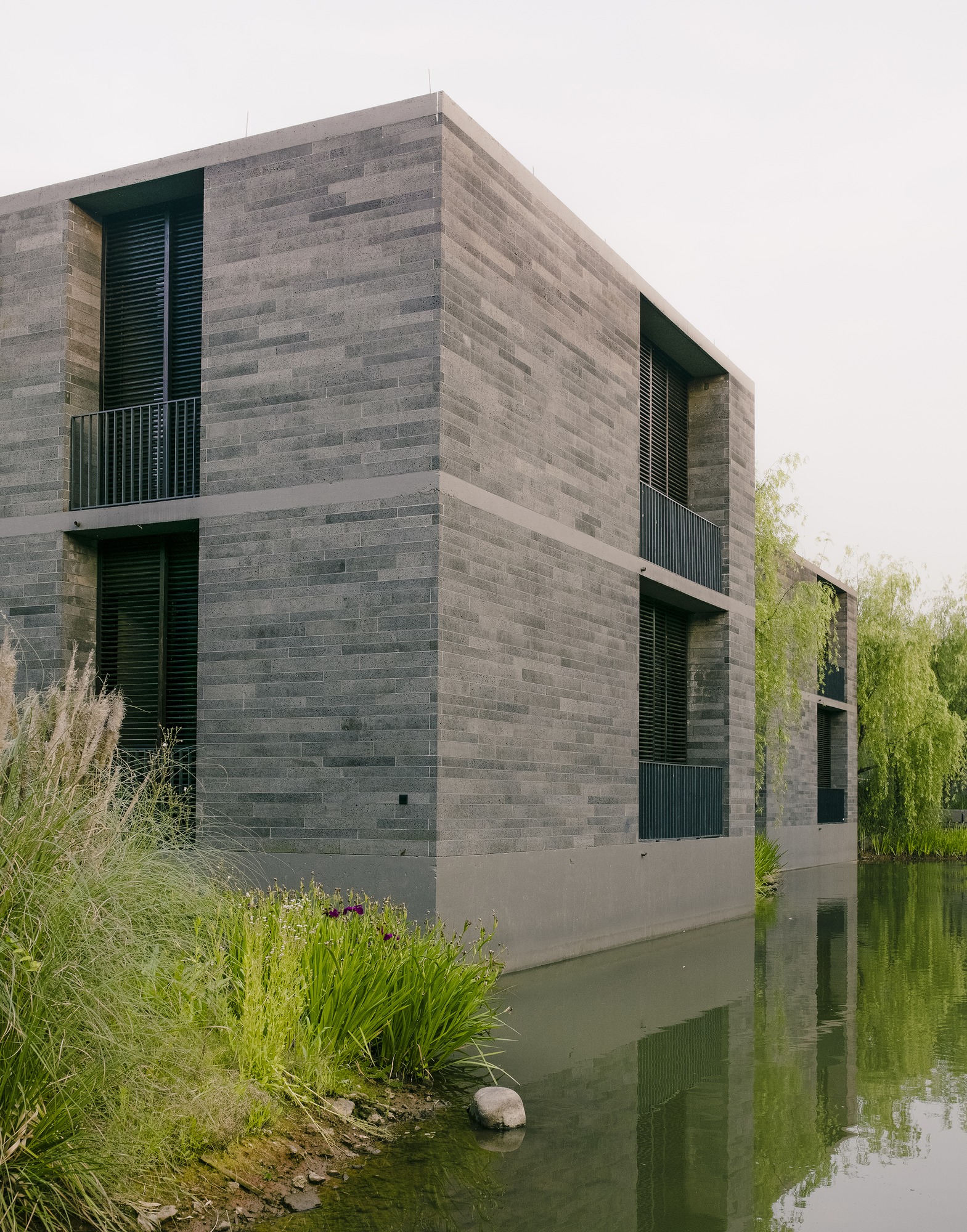 Chipperfield completes 'floating' wetland apartments