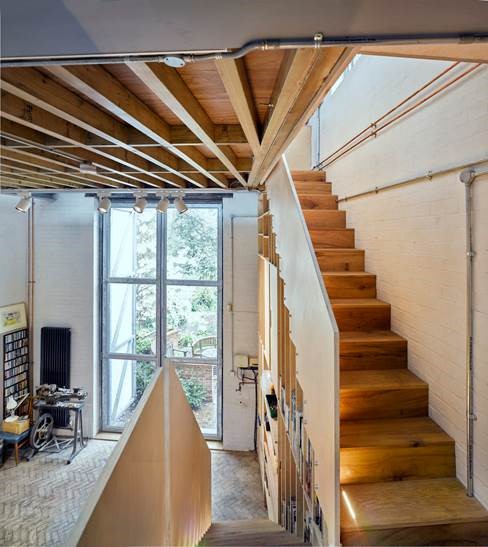 Stairs become storage in Syte Architects’ artist studio conversion