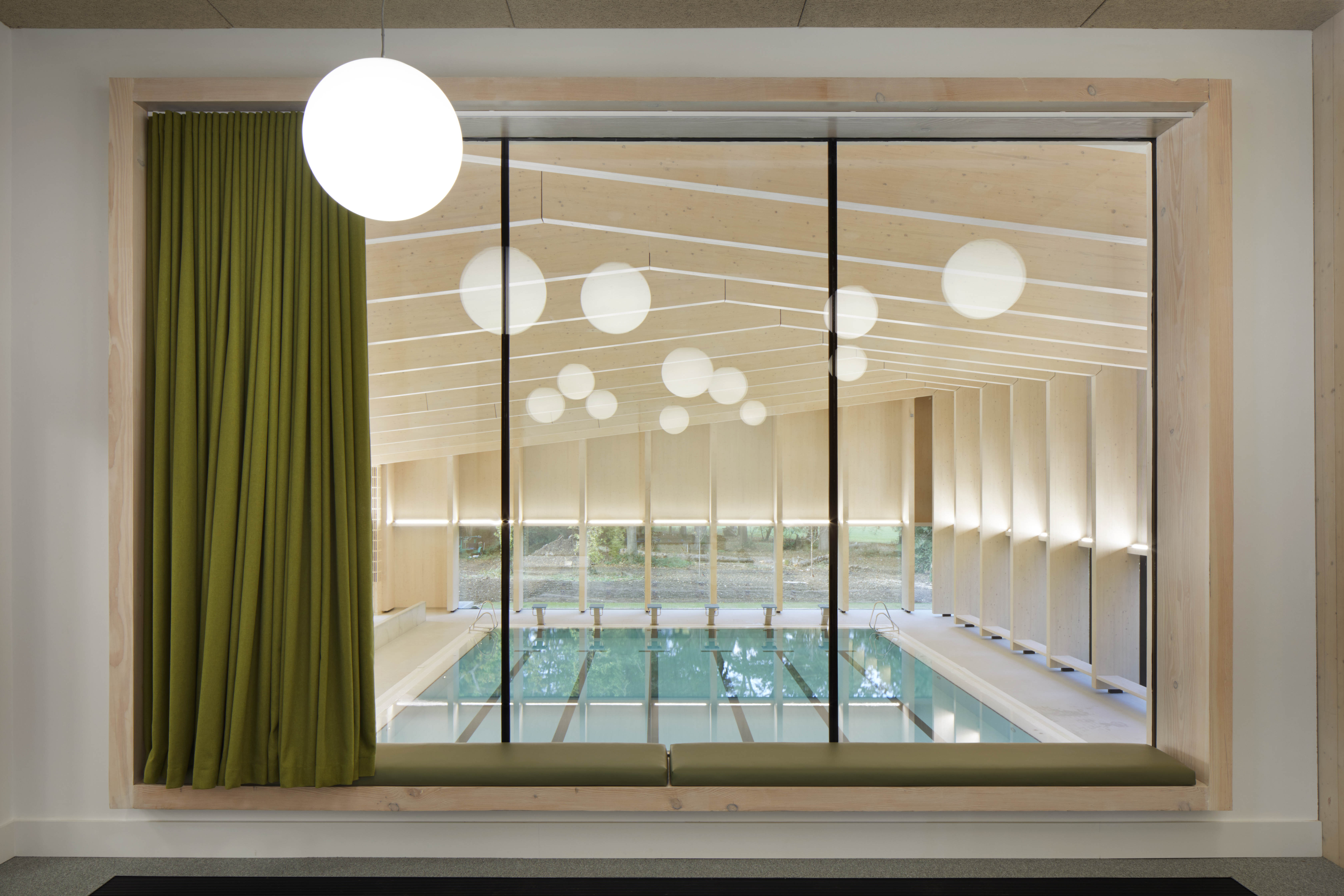 Hawkins\Brown completes engineered timber school swimming pool