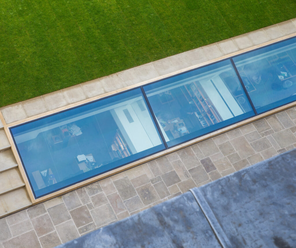 MICA Architects completes underground library at The Queen’s College ...