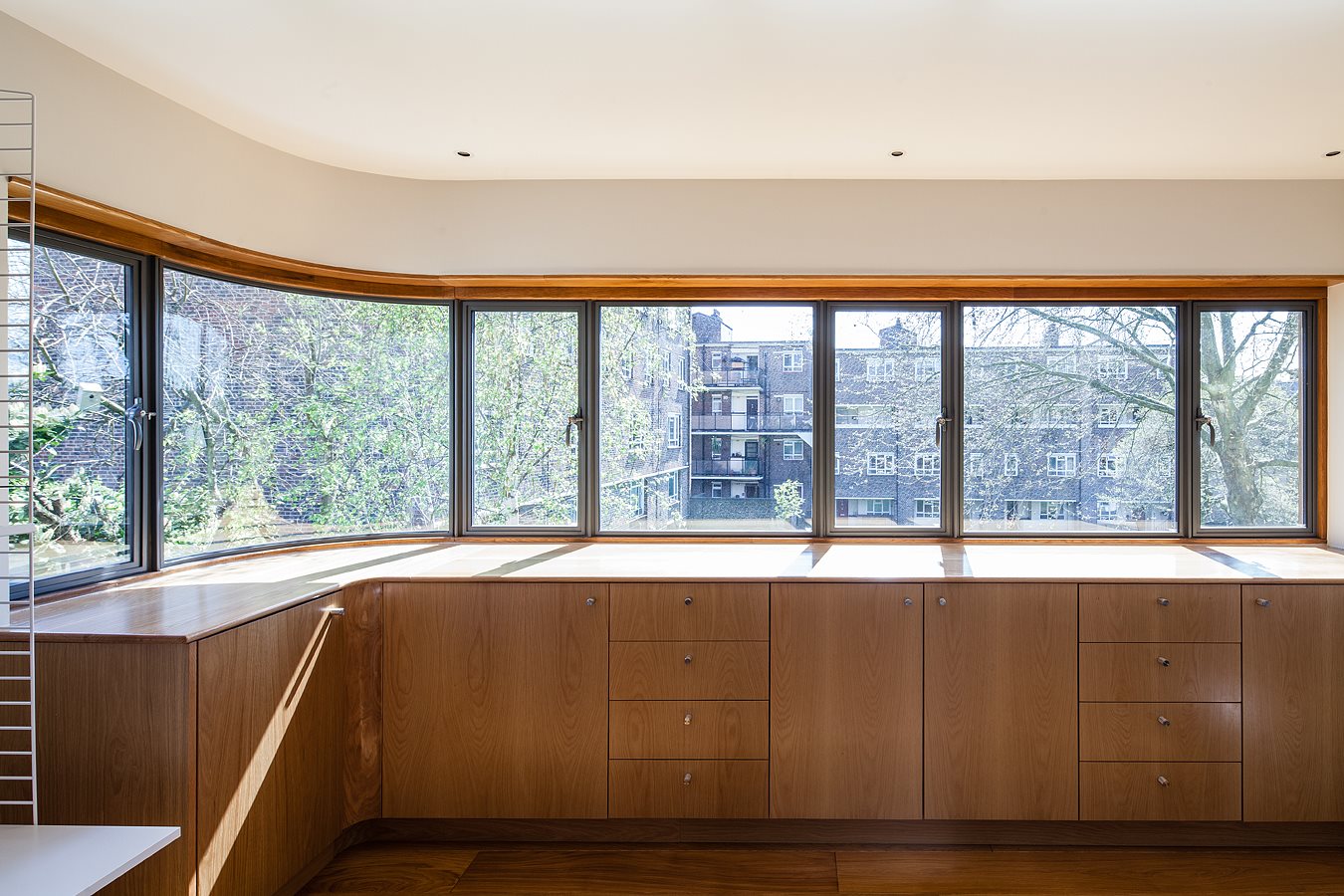 James Dunnett Architects extends London home with curved picture window