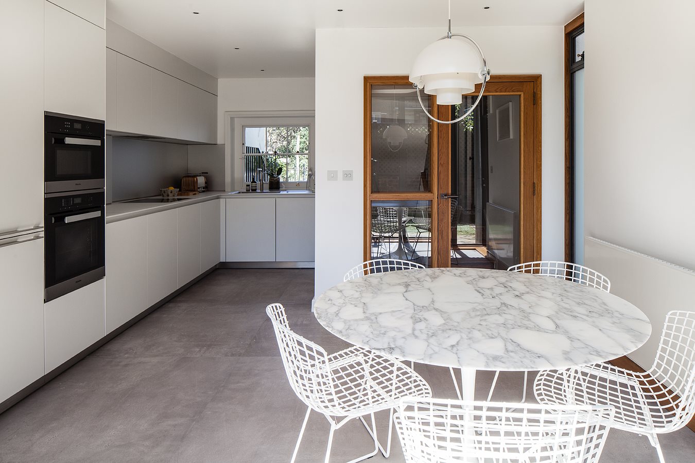 James Dunnett Architects extends London home with curved picture window