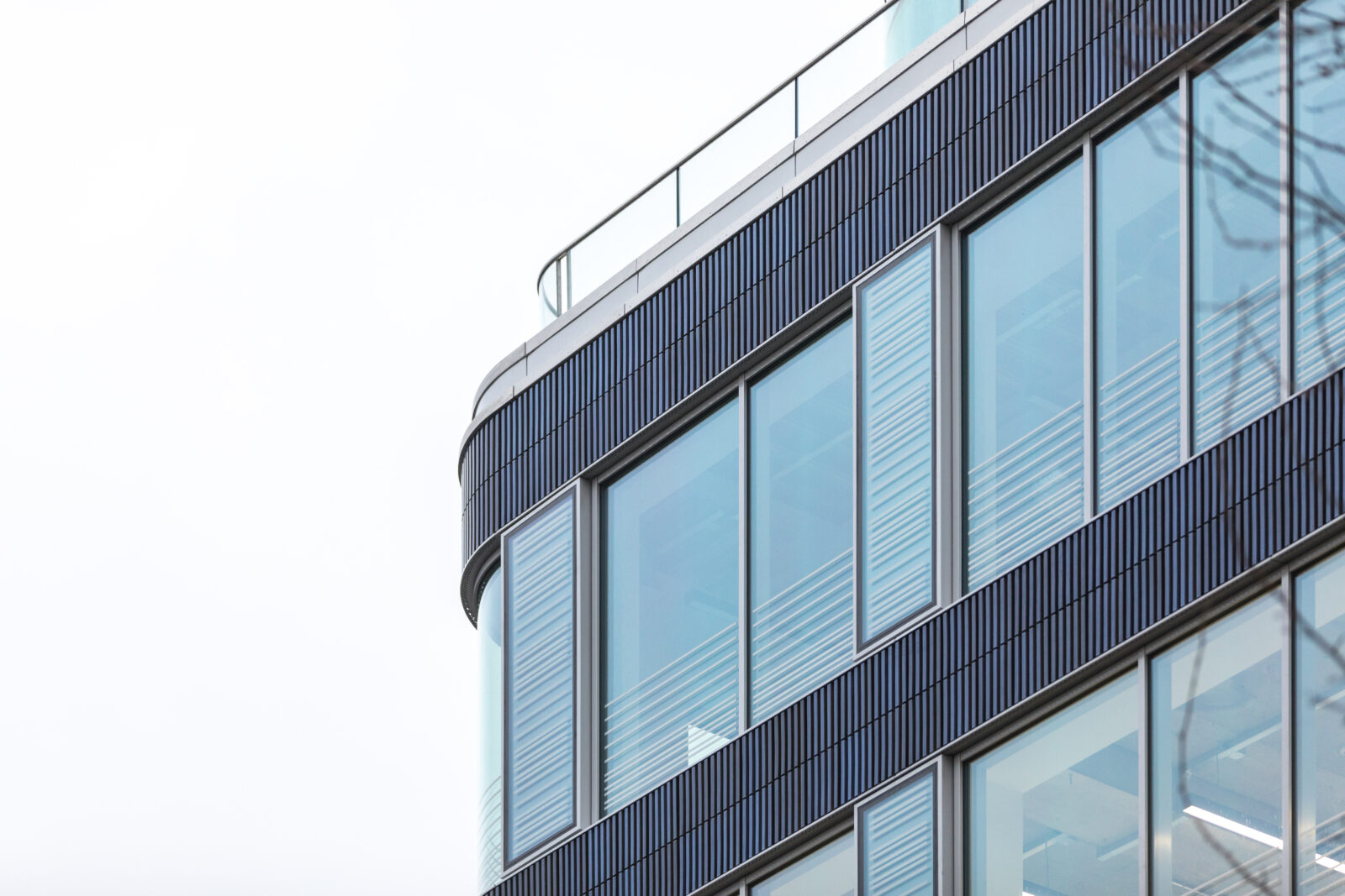 John Robertson Architects clads 1980s building with blue terracotta tiles