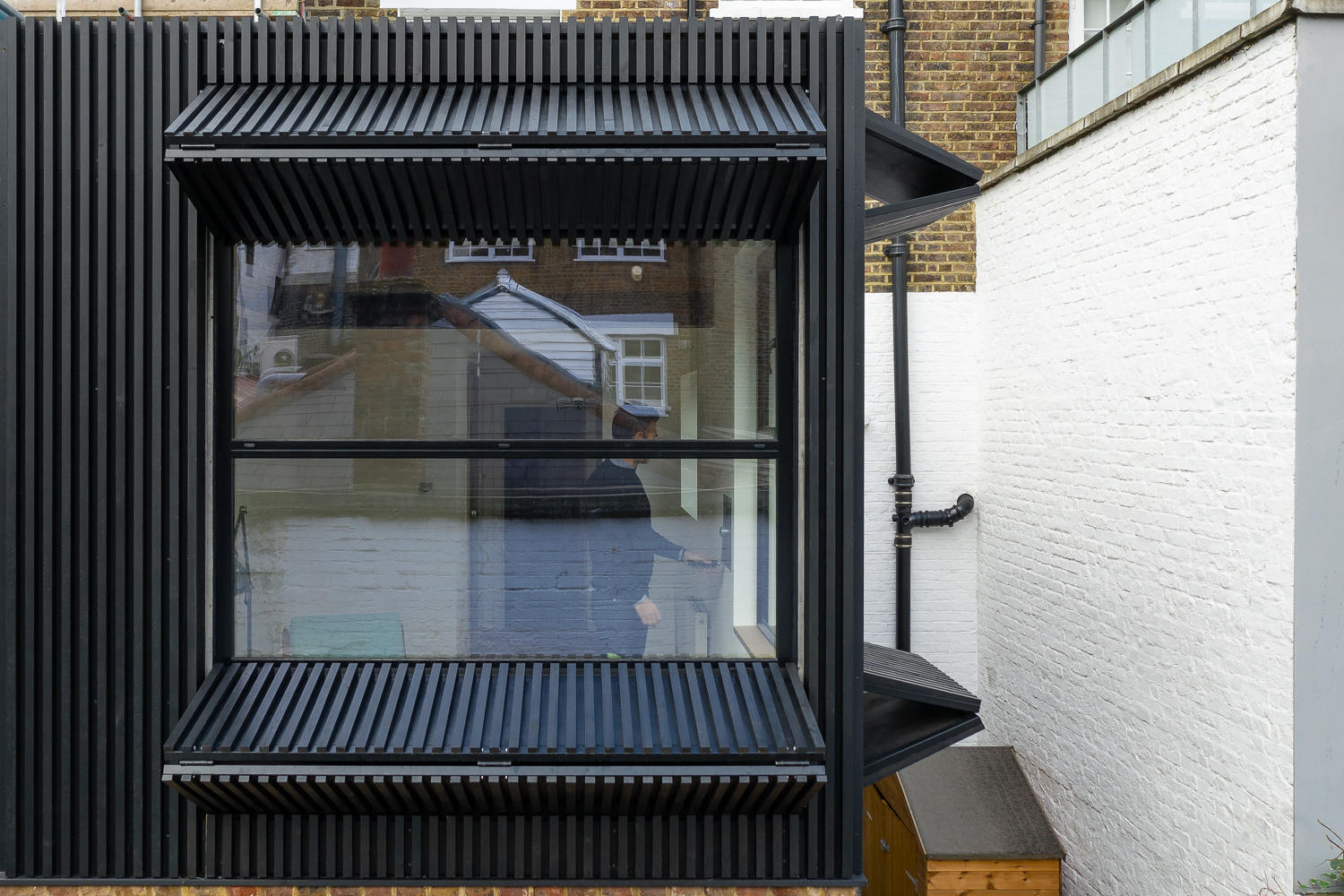 Shutters animate London extension by MATA Architects
