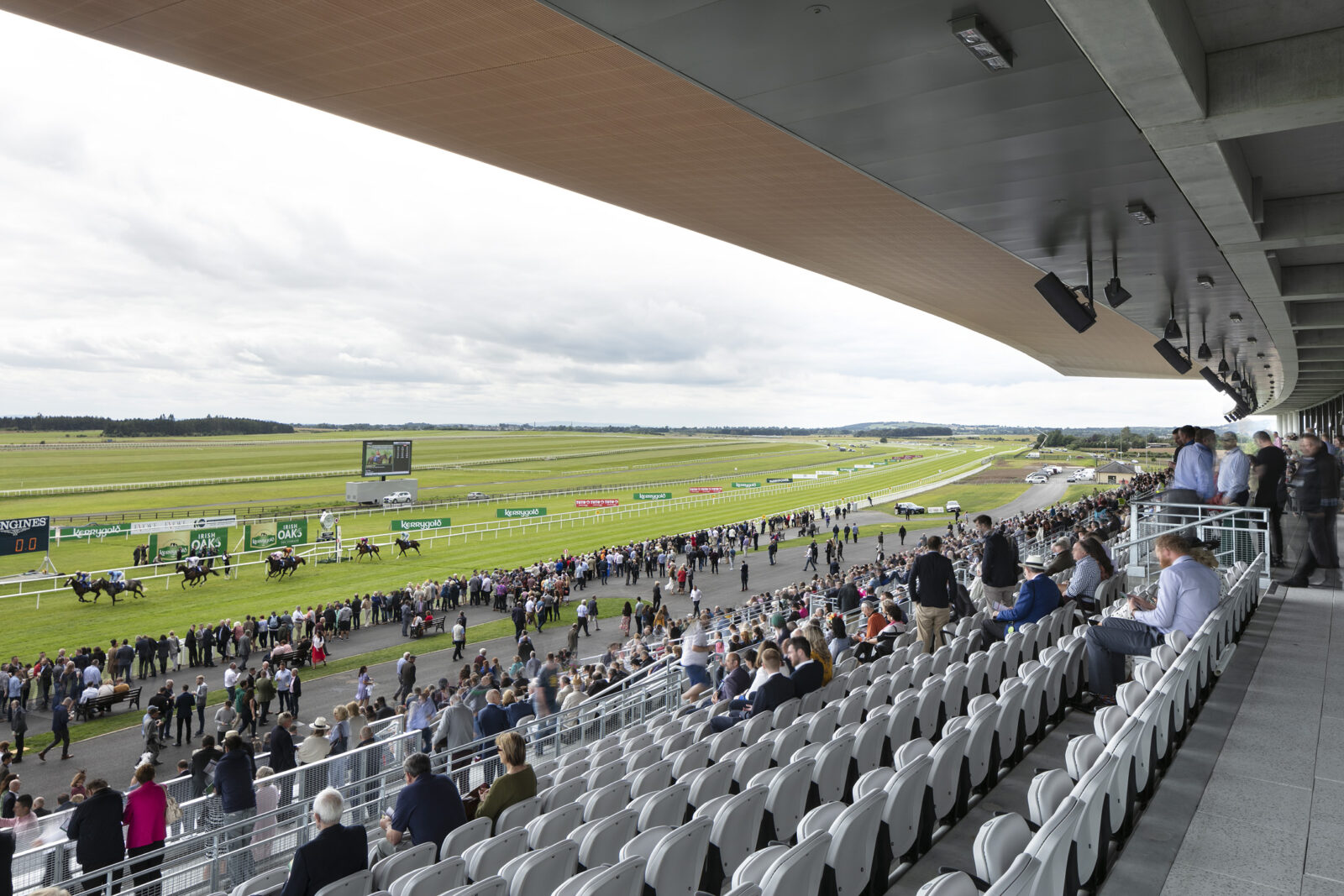 Floating copper roof marks out Grimshaw’s racecourse grandstand