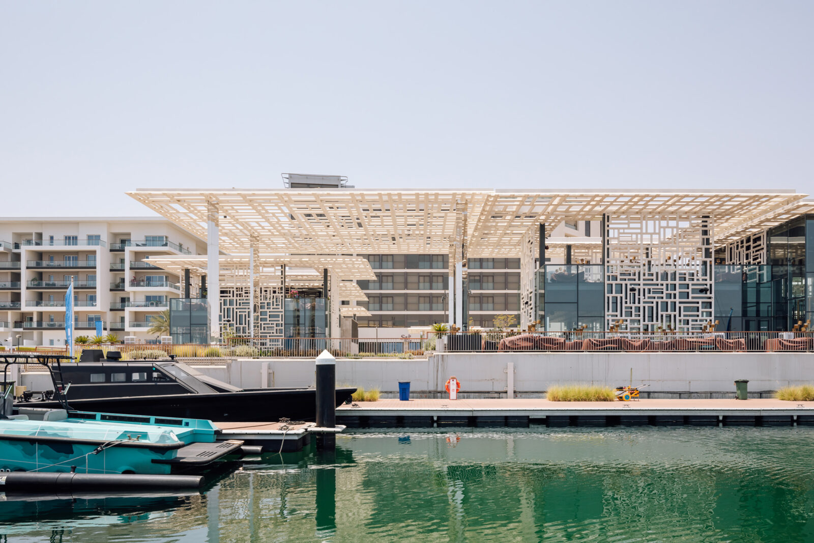 ACME creates stone-fretted waterside square in Muscat