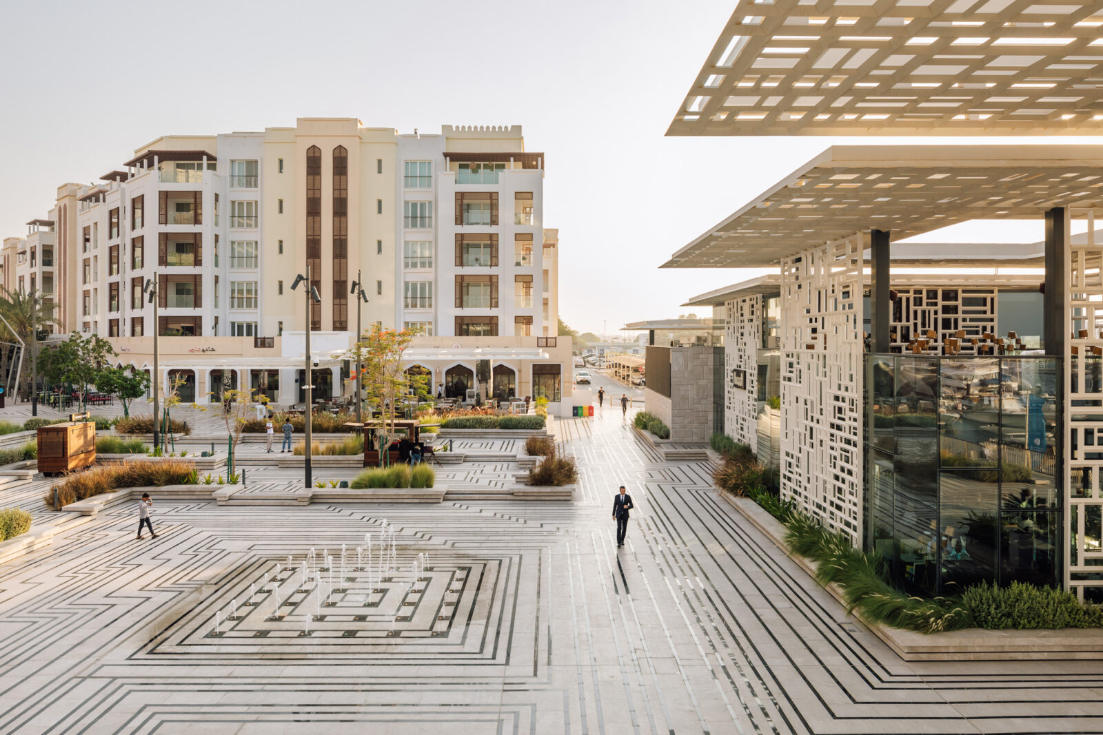 ACME creates stone-fretted waterside square in Muscat