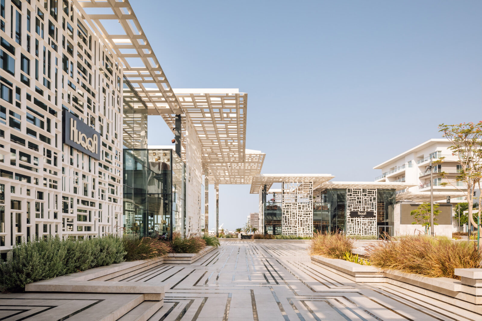 ACME creates stone-fretted waterside square in Muscat