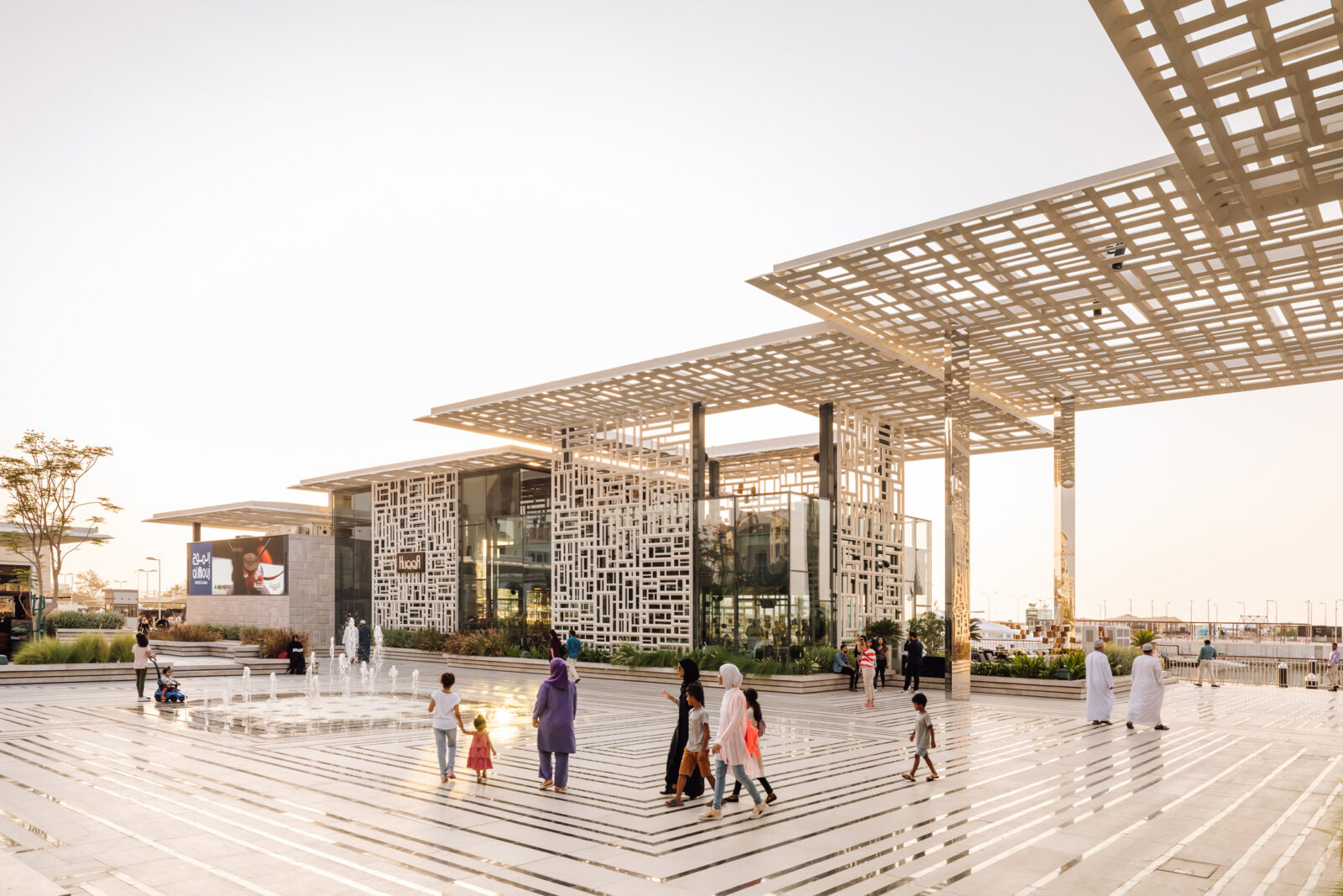 ACME creates stone-fretted waterside square in Muscat