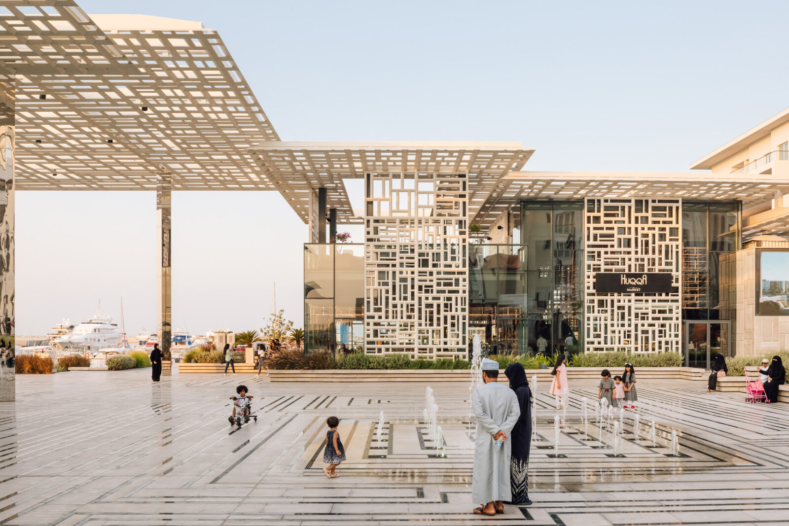 ACME creates stone-fretted waterside square in Muscat