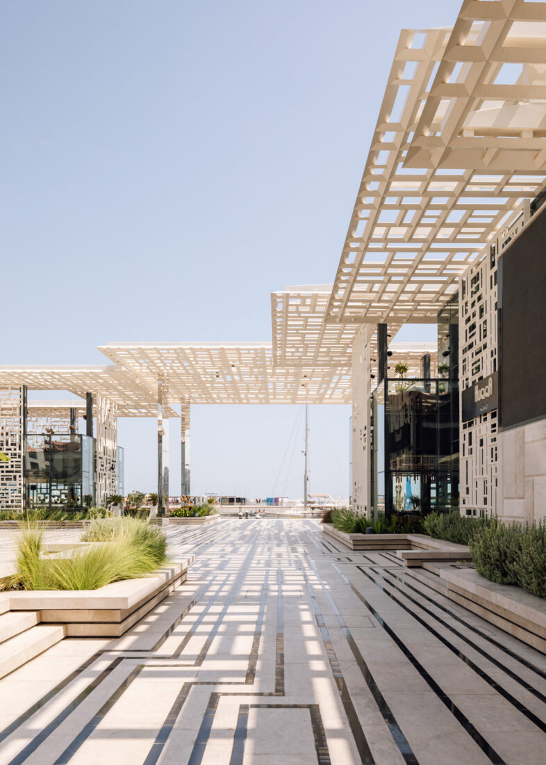 ACME creates stone-fretted waterside square in Muscat