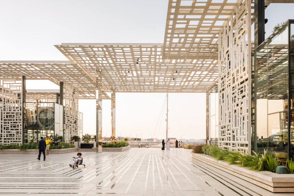 ACME creates stone-fretted waterside square in Muscat