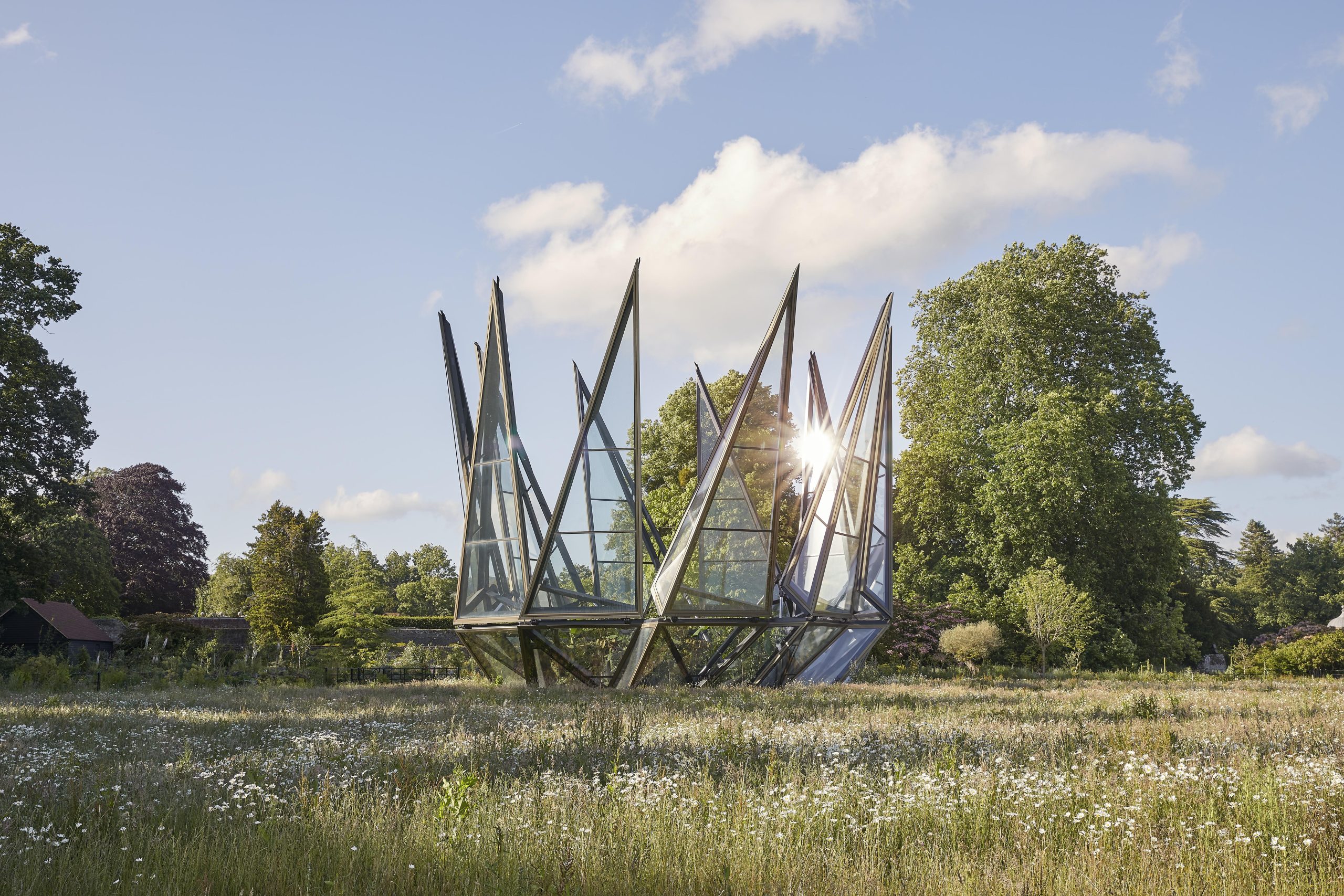 Heatherwick creates 10-sided openable glasshouse for Woolbeding Gardens