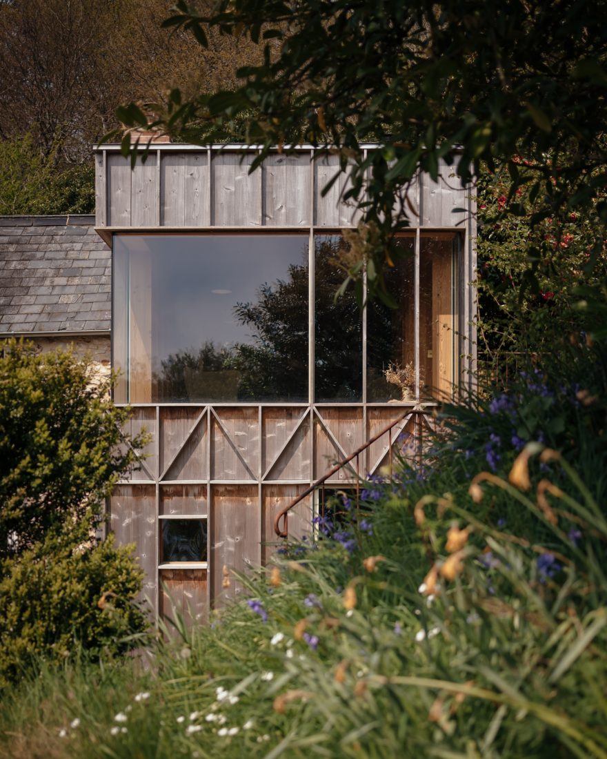 Studio Weave adds timber retreat to stone cottage in Devon