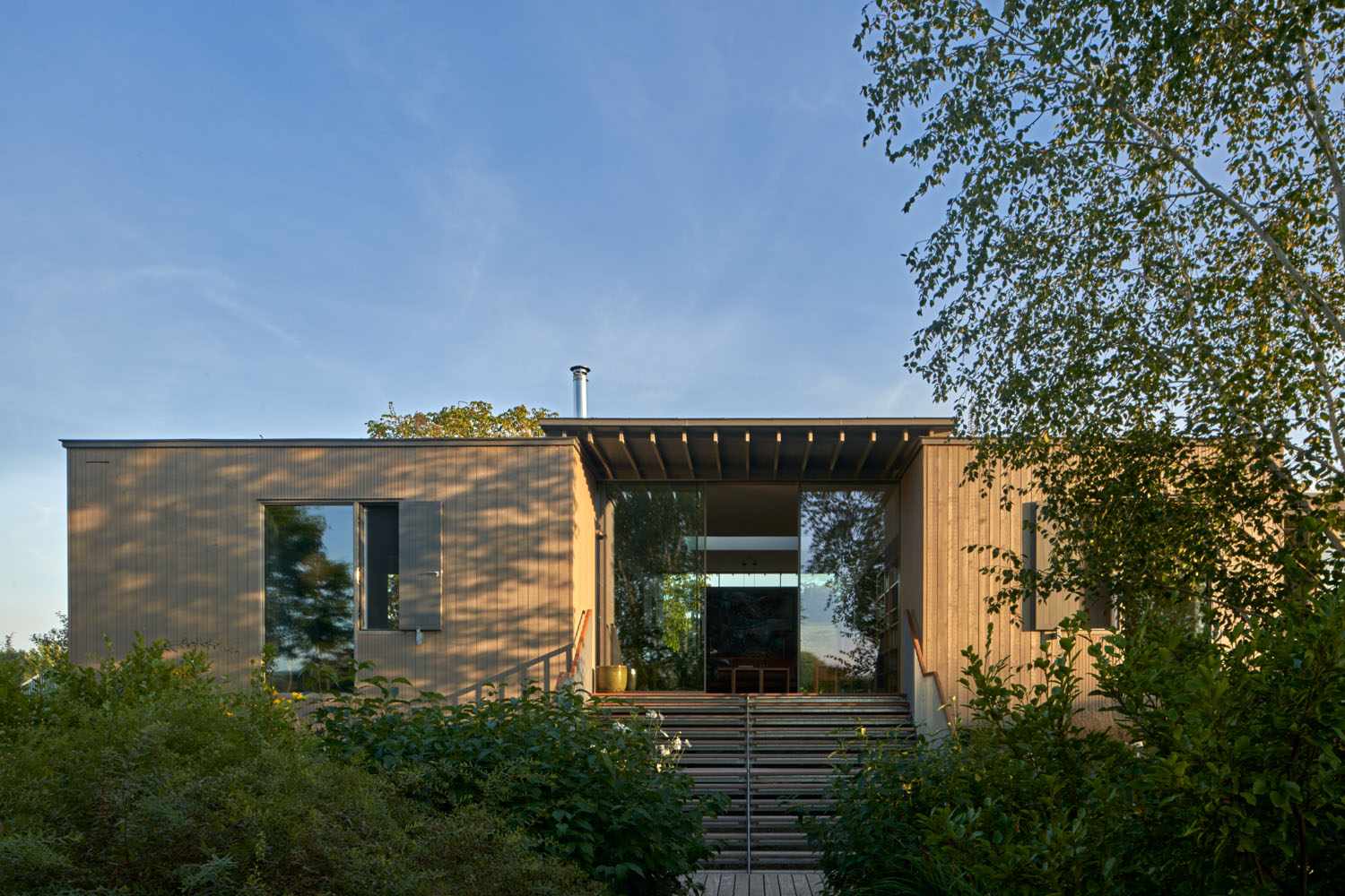 Knox Bhavan completes prefabricated flood-resilient riverside house