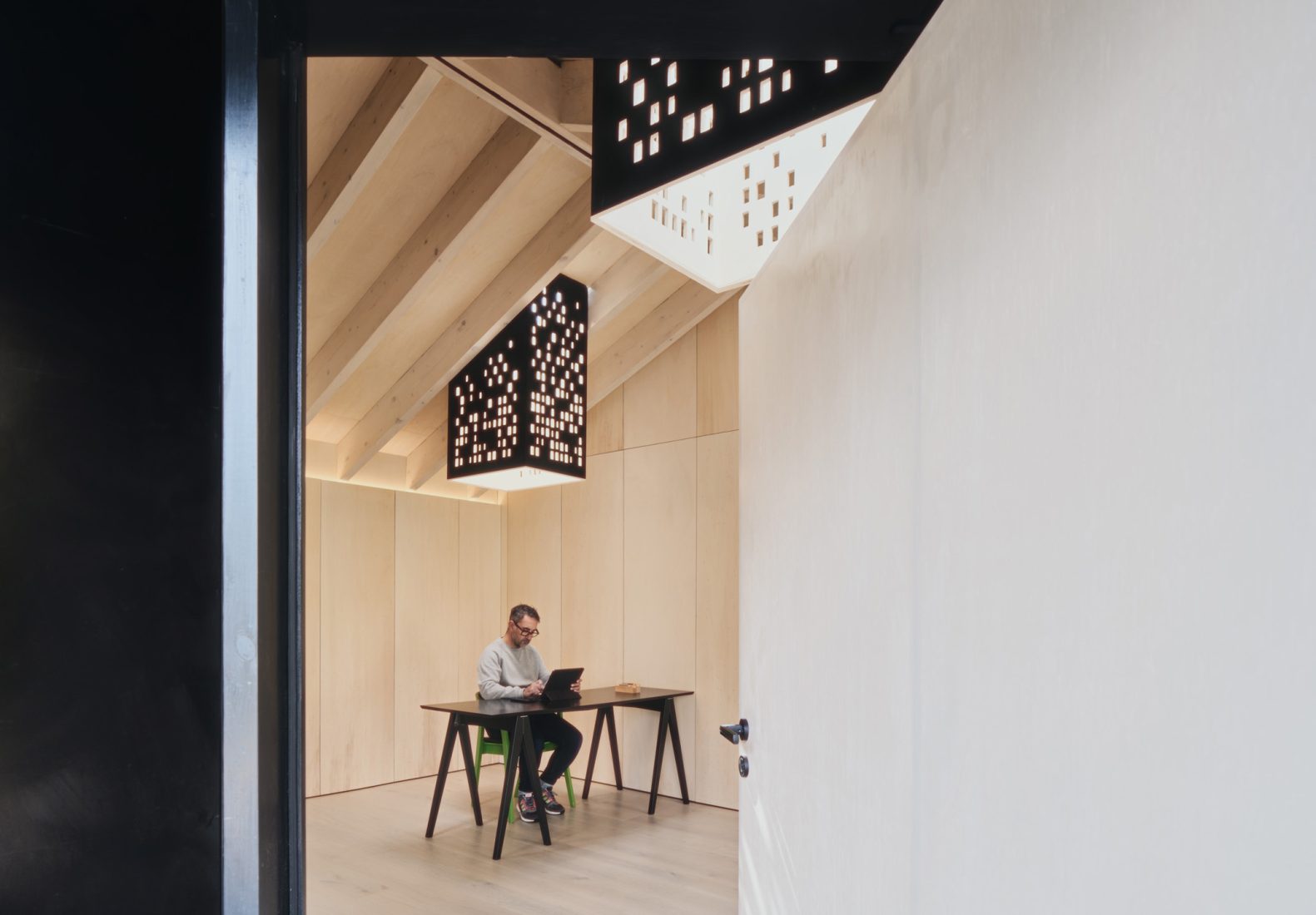 Hyperspace transforms old garage into ‘moody’ studio with bug-hotel façade