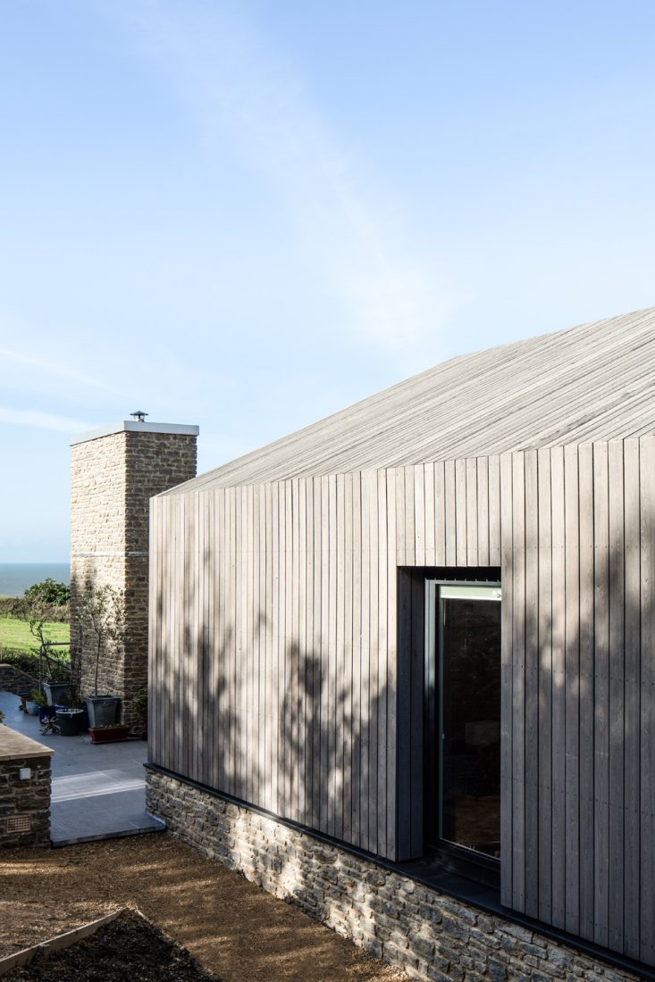 Coffey completes three-volume timber-clad home on Dorset coast