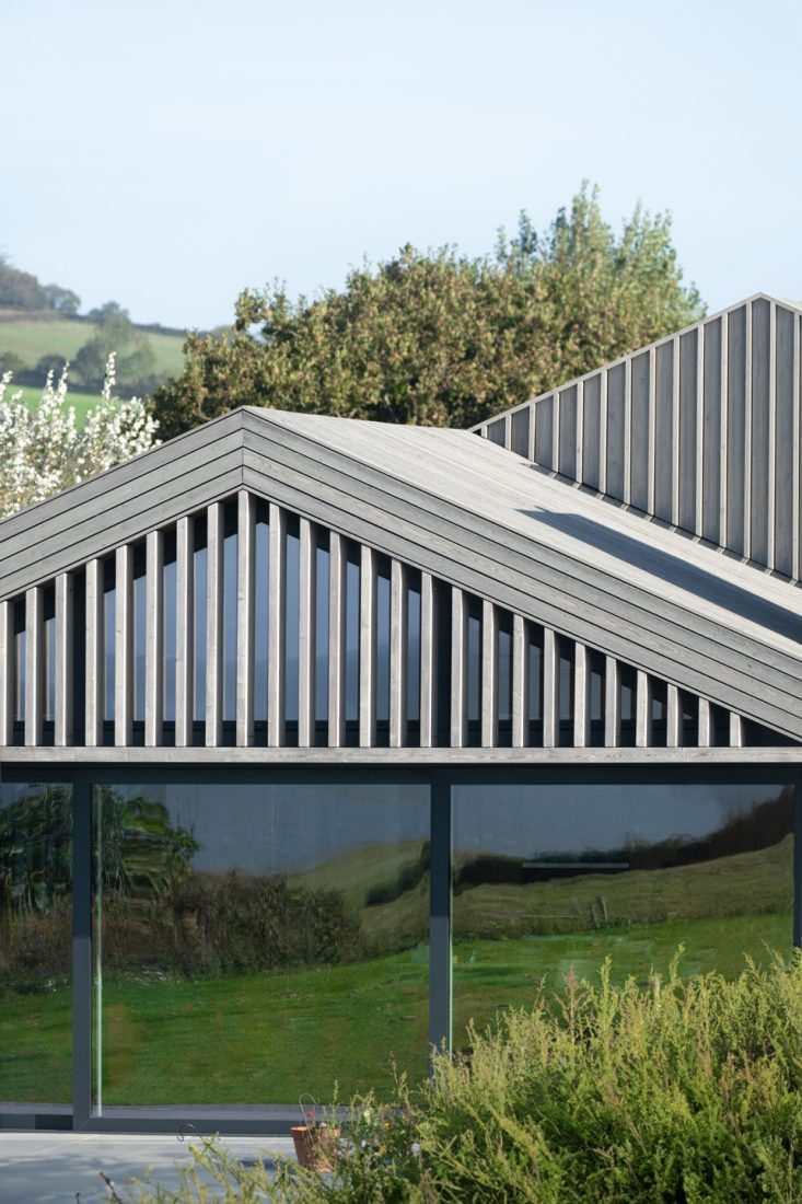 Coffey completes three-volume timber-clad home on Dorset coast