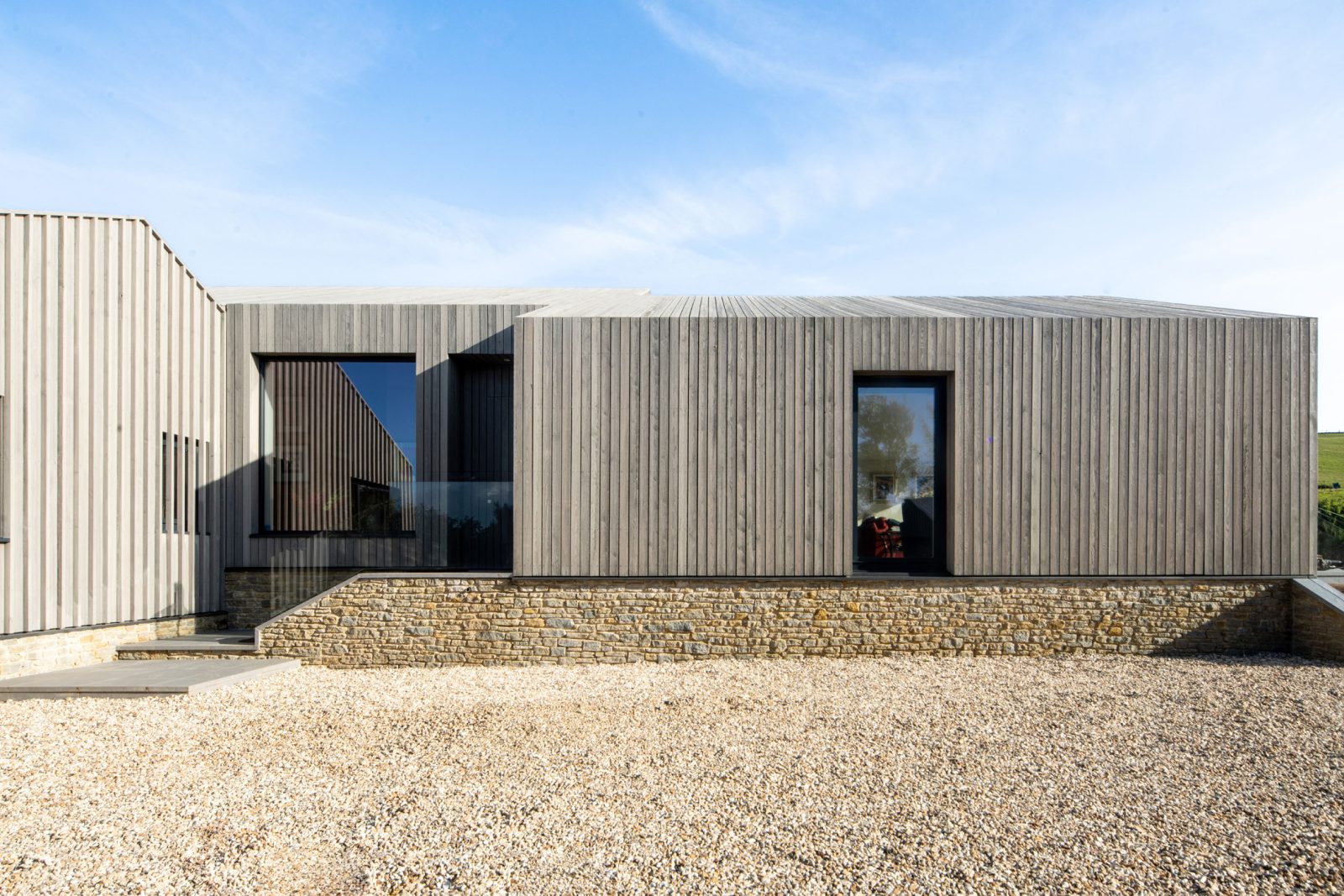 Coffey completes three-volume timber-clad home on Dorset coast