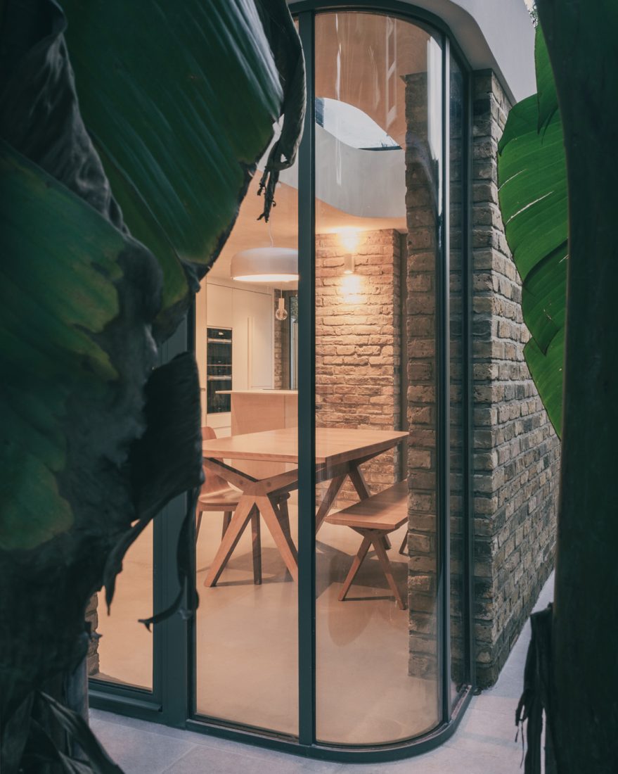 Pensaer completes curved glass-cornered extension in East Dulwich