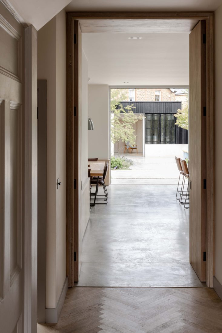 Matthew Giles Architects reworks suburban house with timber-clad extensions