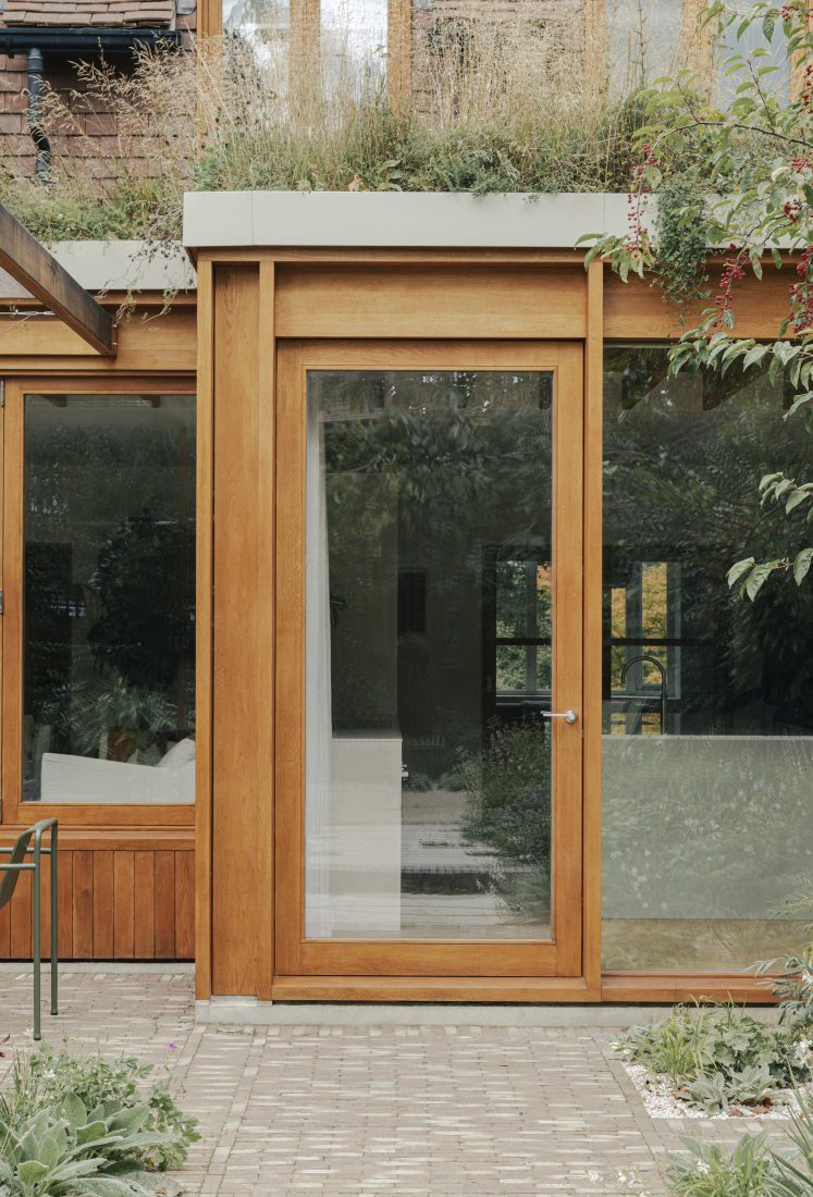 ROAR extends Grade II-listed house with oak-framed living space and pergola