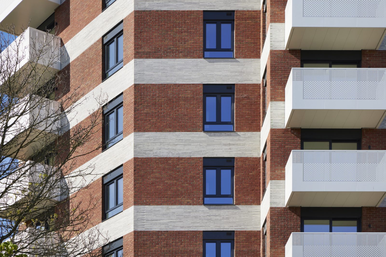 GRID Architects completes housing tower for vulnerable women